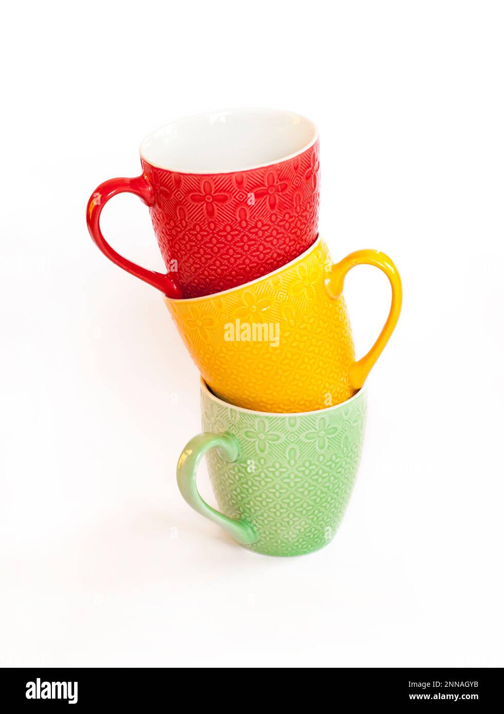 Colorful mugs isolated on white background Stock Photo - Alamy