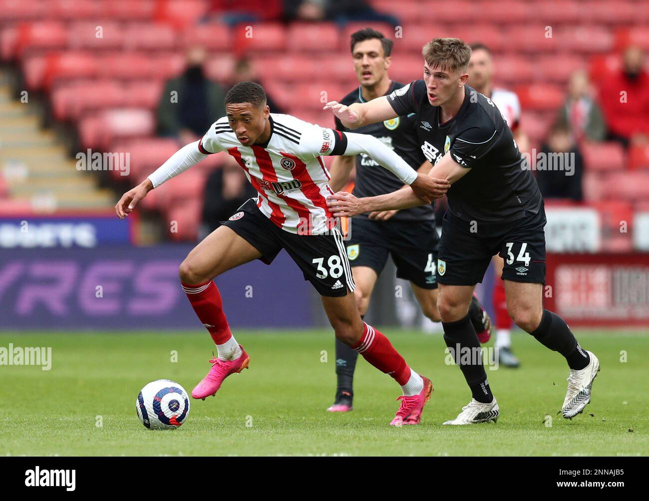 Sheffield United's Daniel Jebbison, left, and Burnley's Jimmy Dunne ...