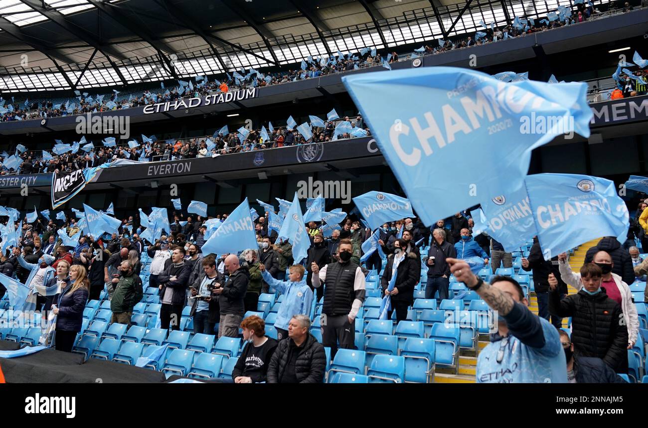 Manchester supporters wave flags before the English Premier League ...