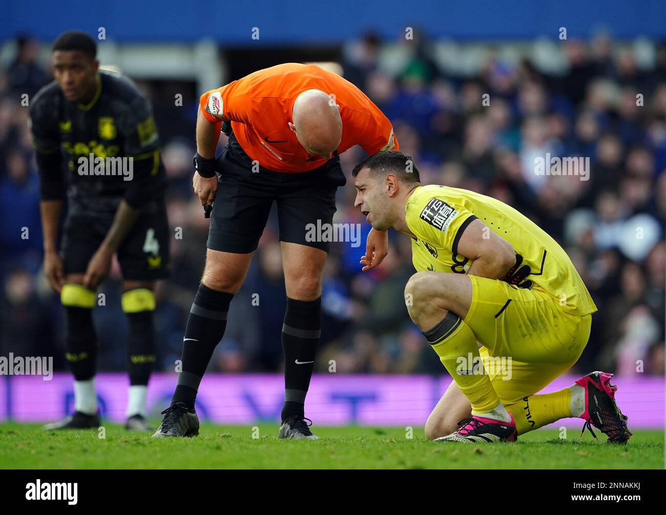 Aston Villa goalkeeper Emiliano Martinez reacts after a collision ...