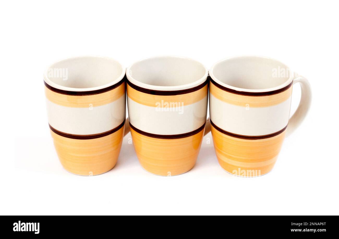 Row of three mugs isolated on white background Stock Photo - Alamy