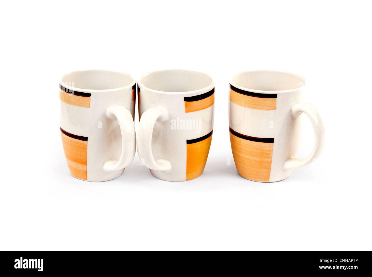 Stack of three mugs isolated on white background with clipping path ...
