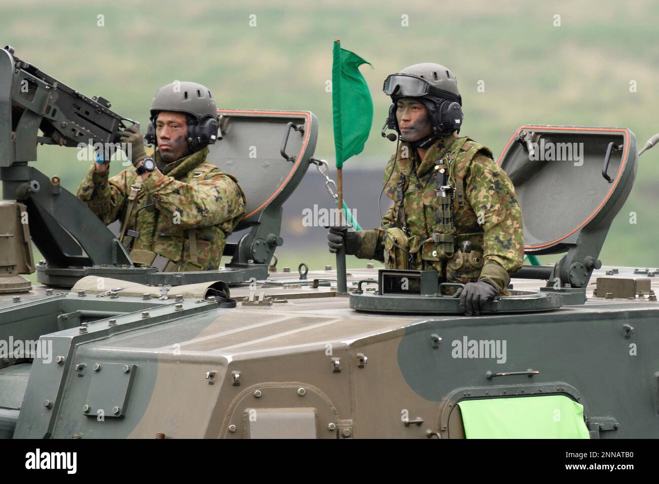Japan's Ground Self-Defense Forces (JGSDF) soldiers ride a Type 99 ...