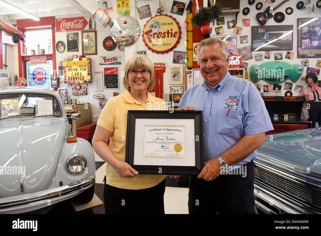 Janet and Jerry Enders hold a framed Certificate of Appreciation given ...