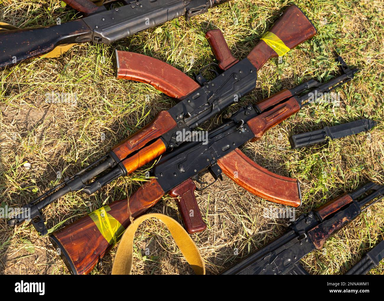 Military machine gun lies on the dry grass in the field Stock Photo - Alamy