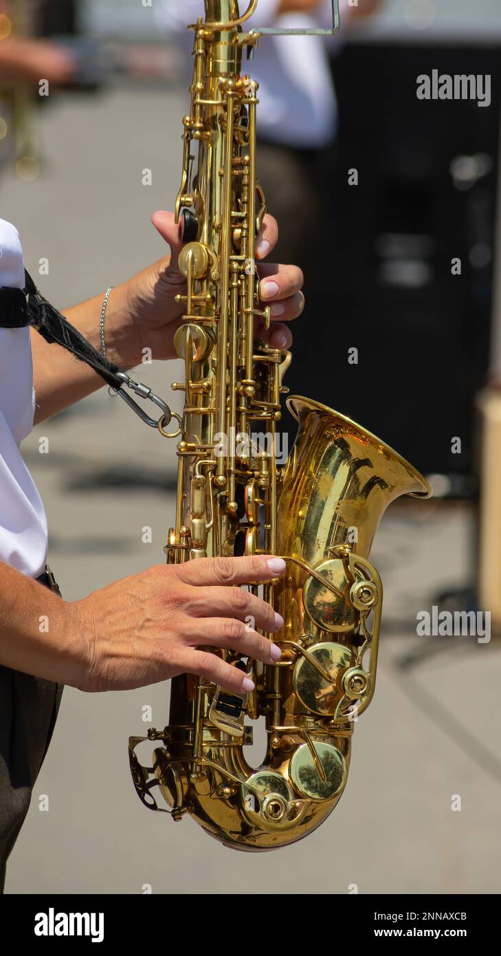 playing a brass instrument. military band performs at the festival ...
