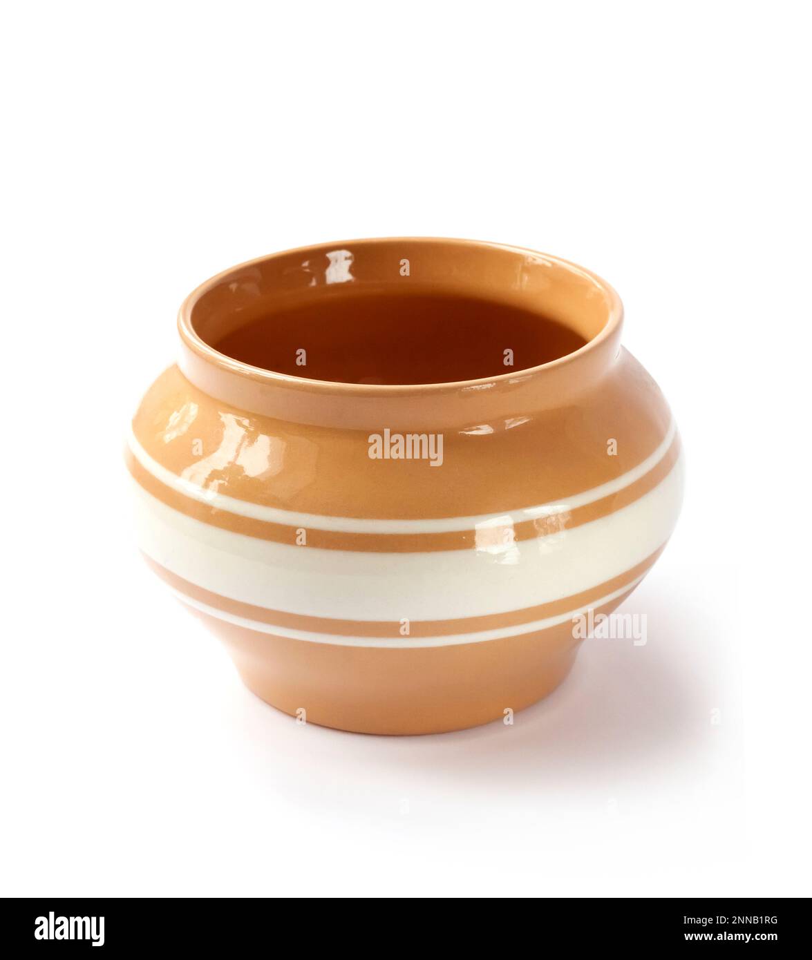 Glazed ceramic pot for cooking on a white background with clipping path ...