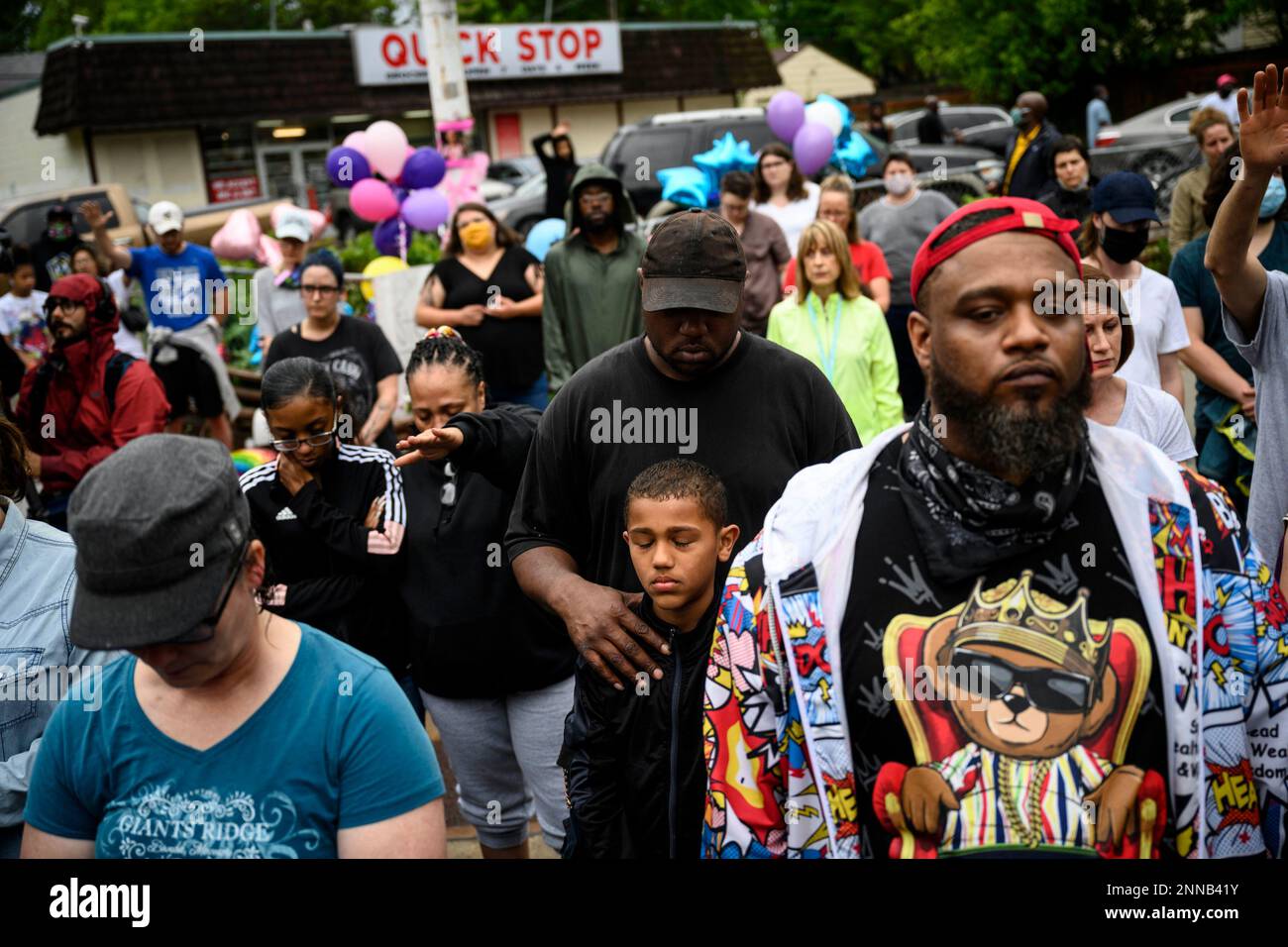 Community members pray at a vigil for Aniya Allen in Minneapolis ...