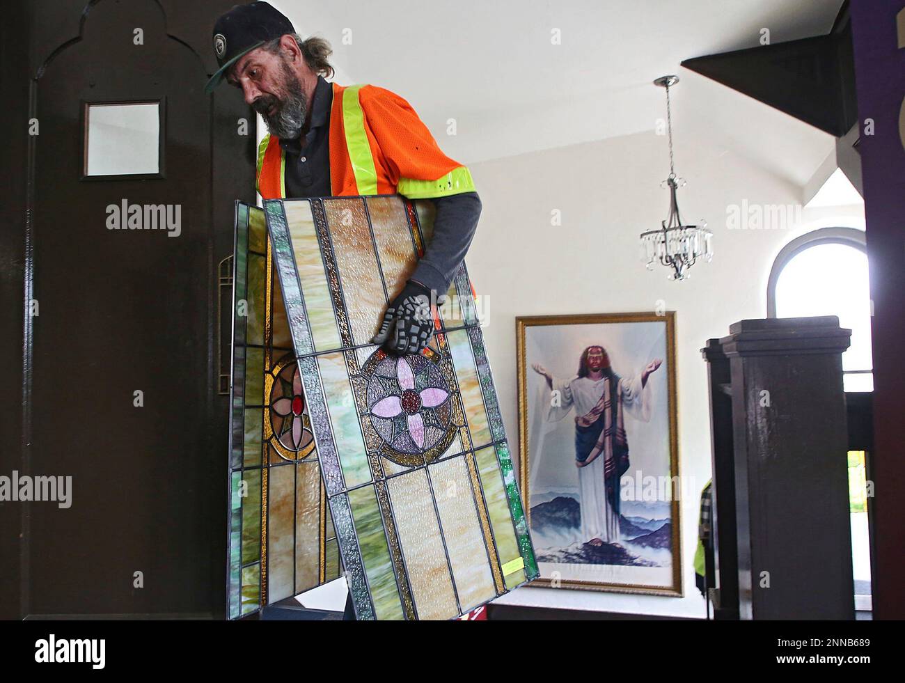 Brett Wyatt of Scottish Stained Glass carries stained glass windows ...