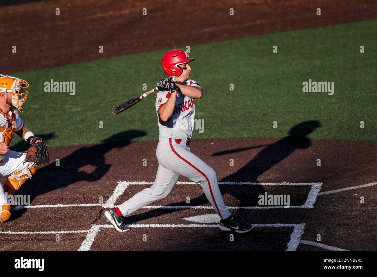 Arkansas Razorbacks second baseman Robert Moore (1) belts a two-run ...