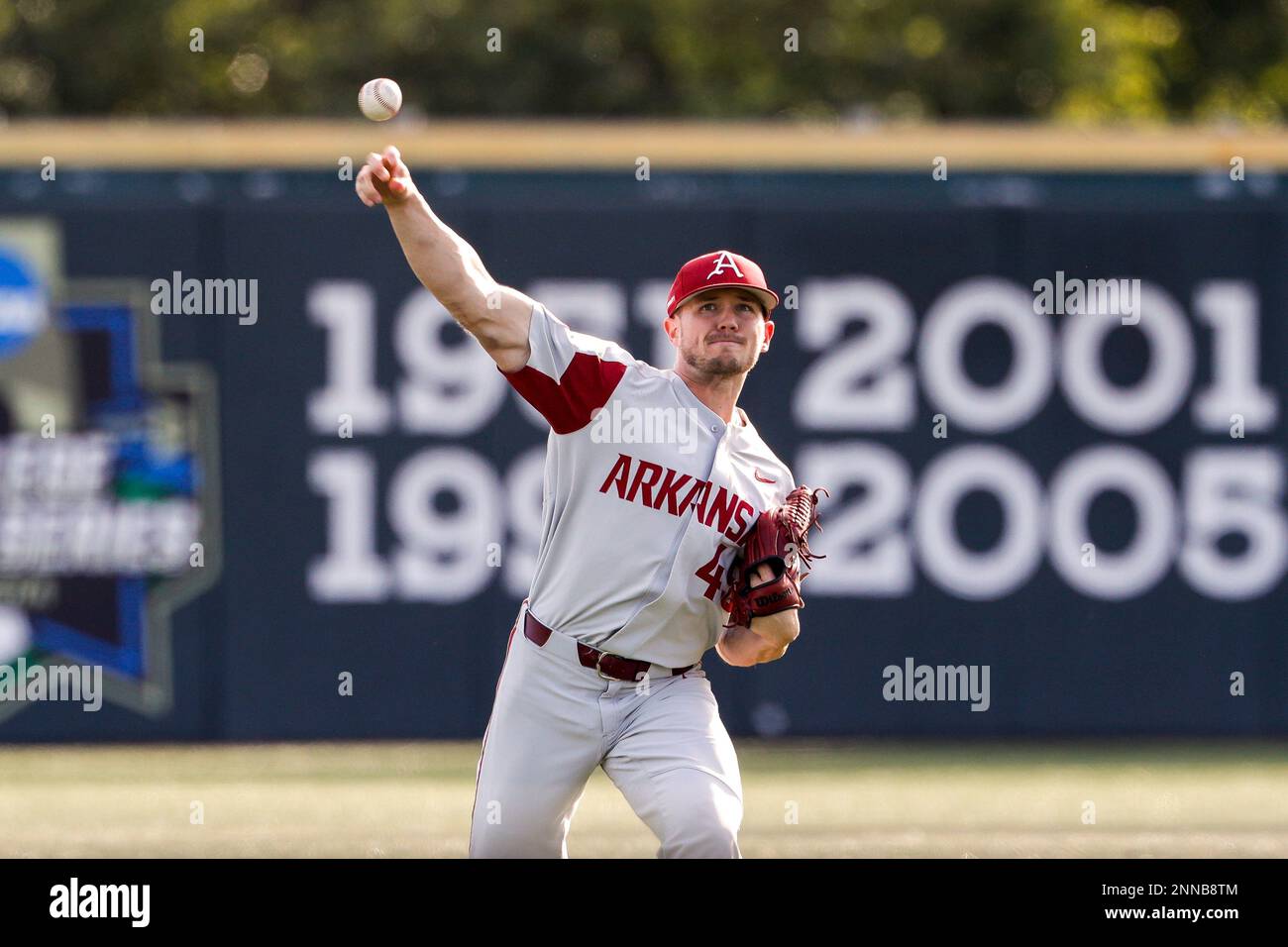 Arkansas Razorbacks pitcher Kevin Kopps (45) warms up in the outfield ...