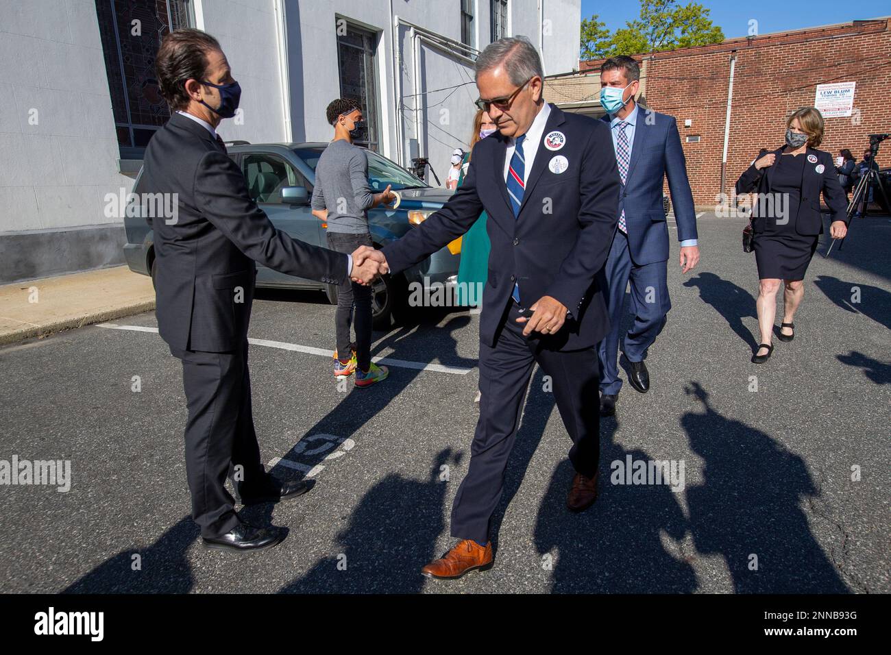 Philadelphia District Attorney Larry Krasner shake the hand of Craig ...