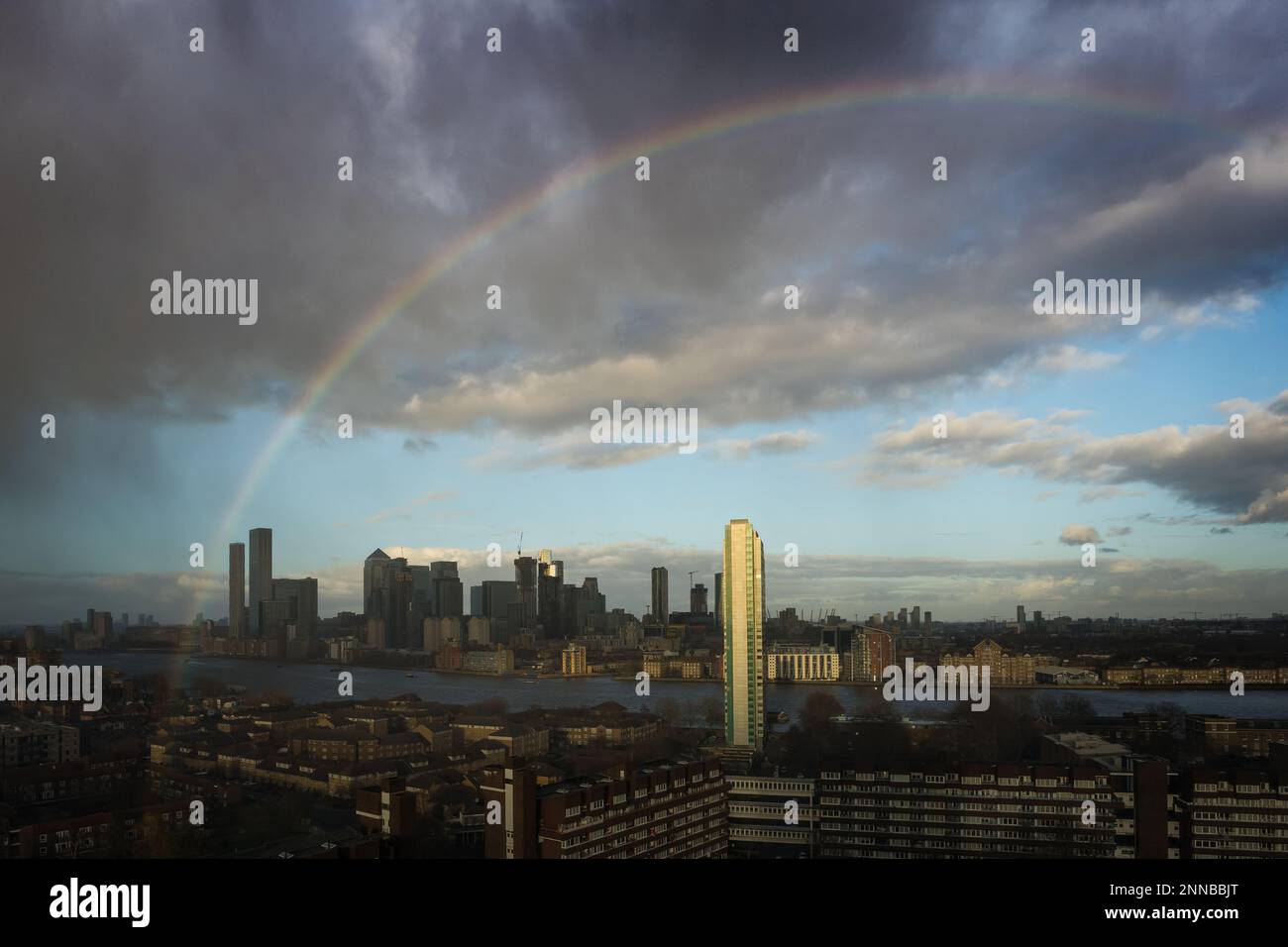 London, UK. 25th February, 2023. UK Weather: A massive rainbow breaks ...
