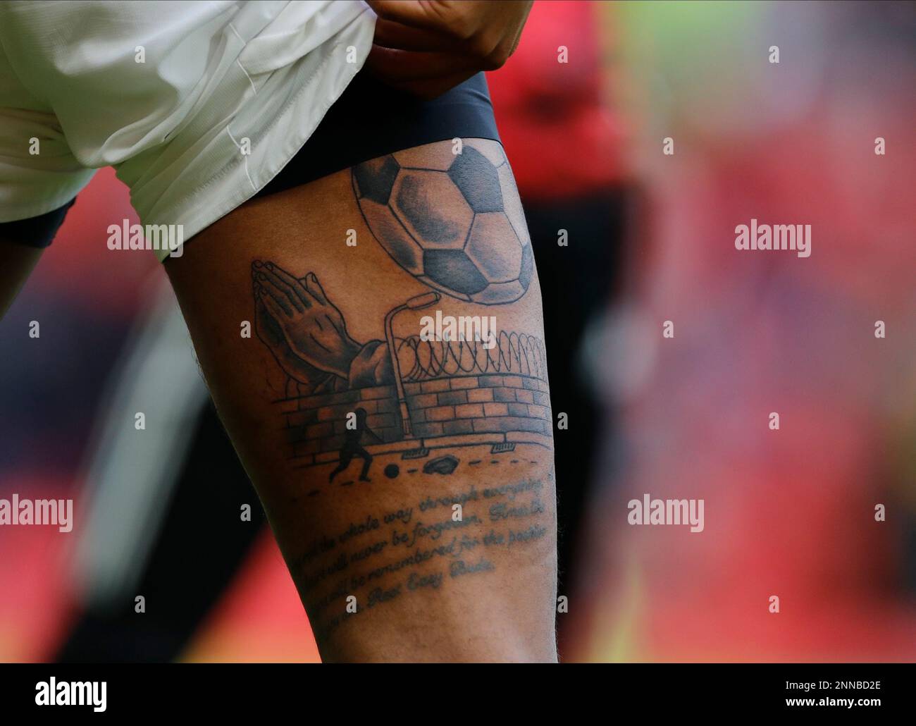 A tattoo is seen on the leg of Manchester United's Marcus Rashford ...