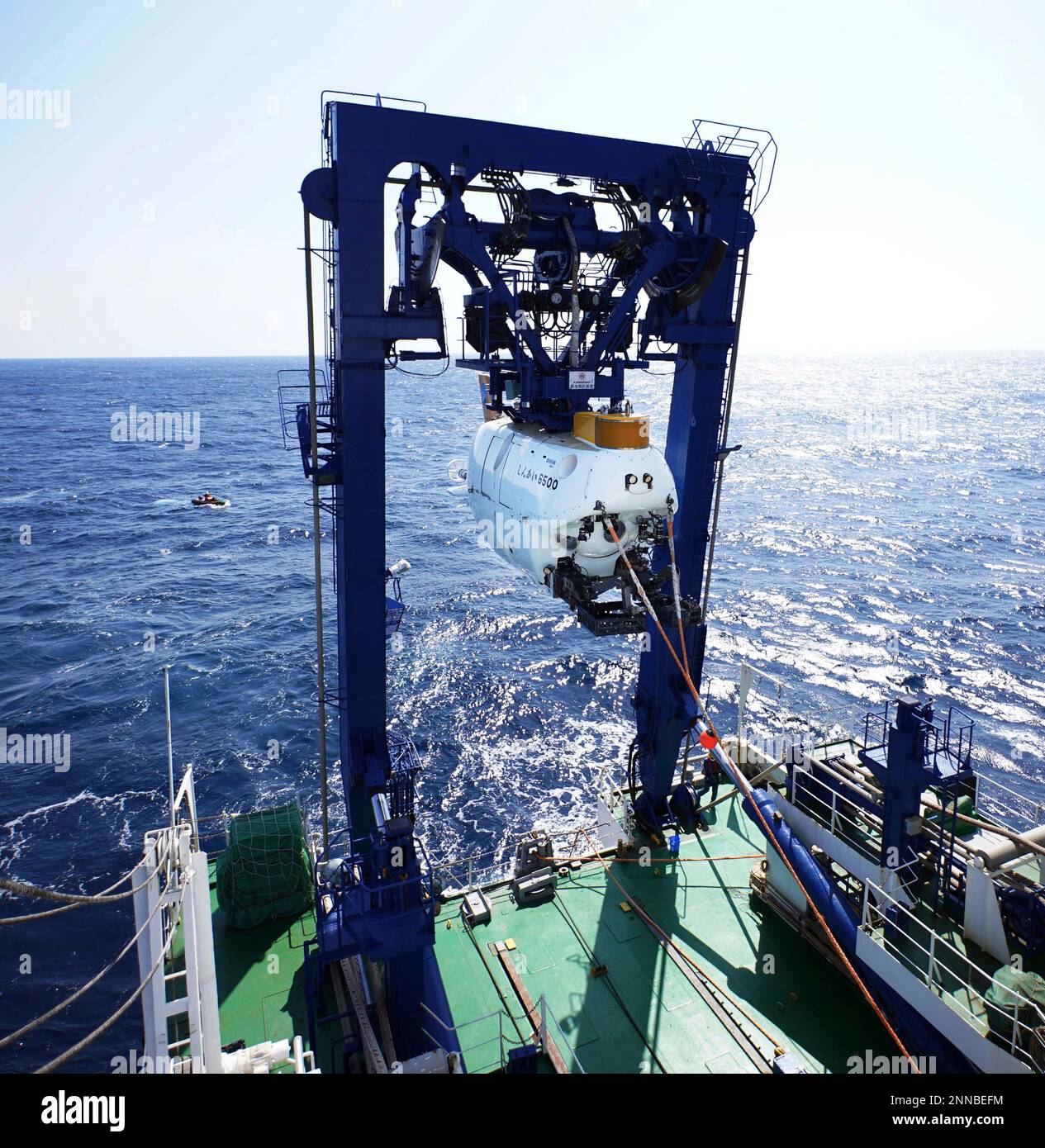 Shinkai 6500 is lifted from the mother ship off the coast of Suruga Bay ...