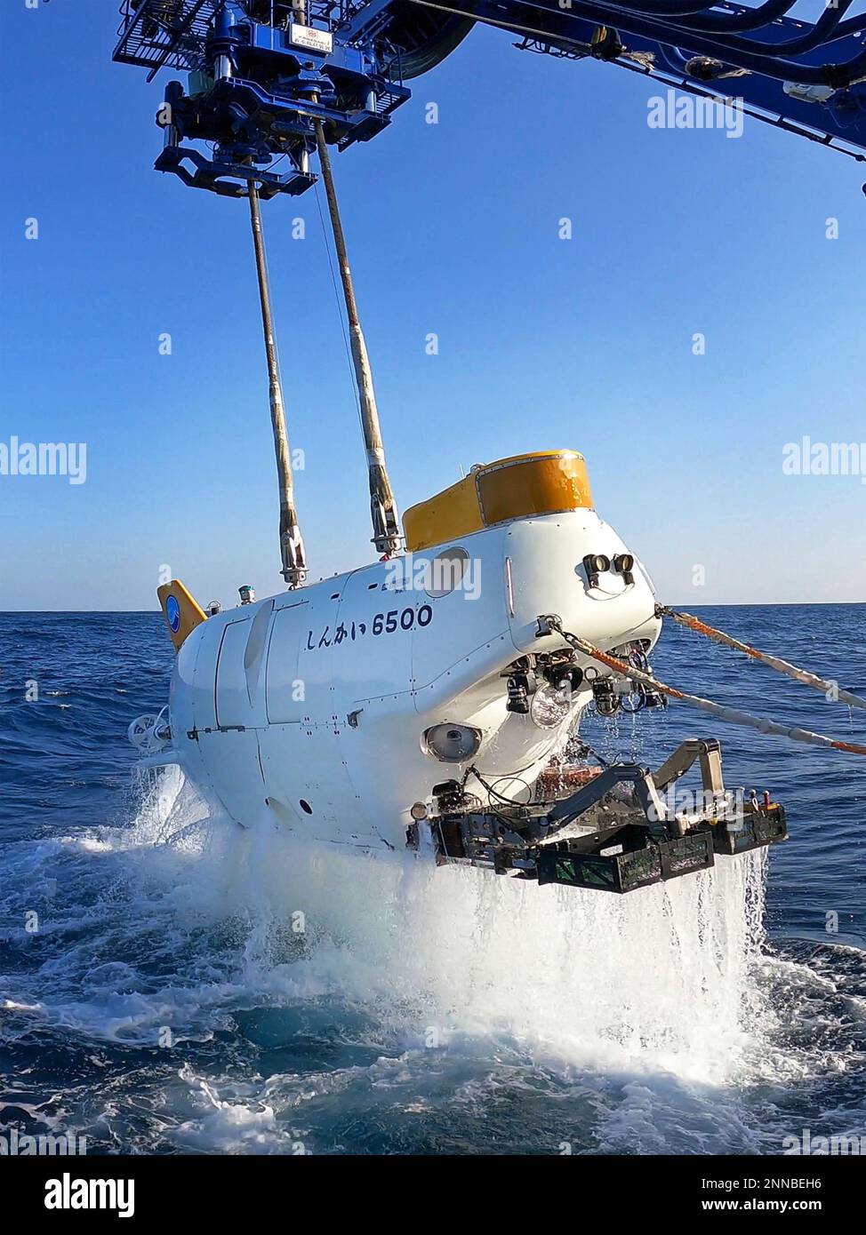 Shinkai 6500 is lifted from the mother ship off the coast of Suruga Bay ...