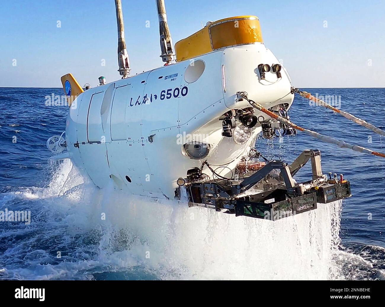 Shinkai 6500 is lifted from the mother ship off the coast of Suruga Bay ...