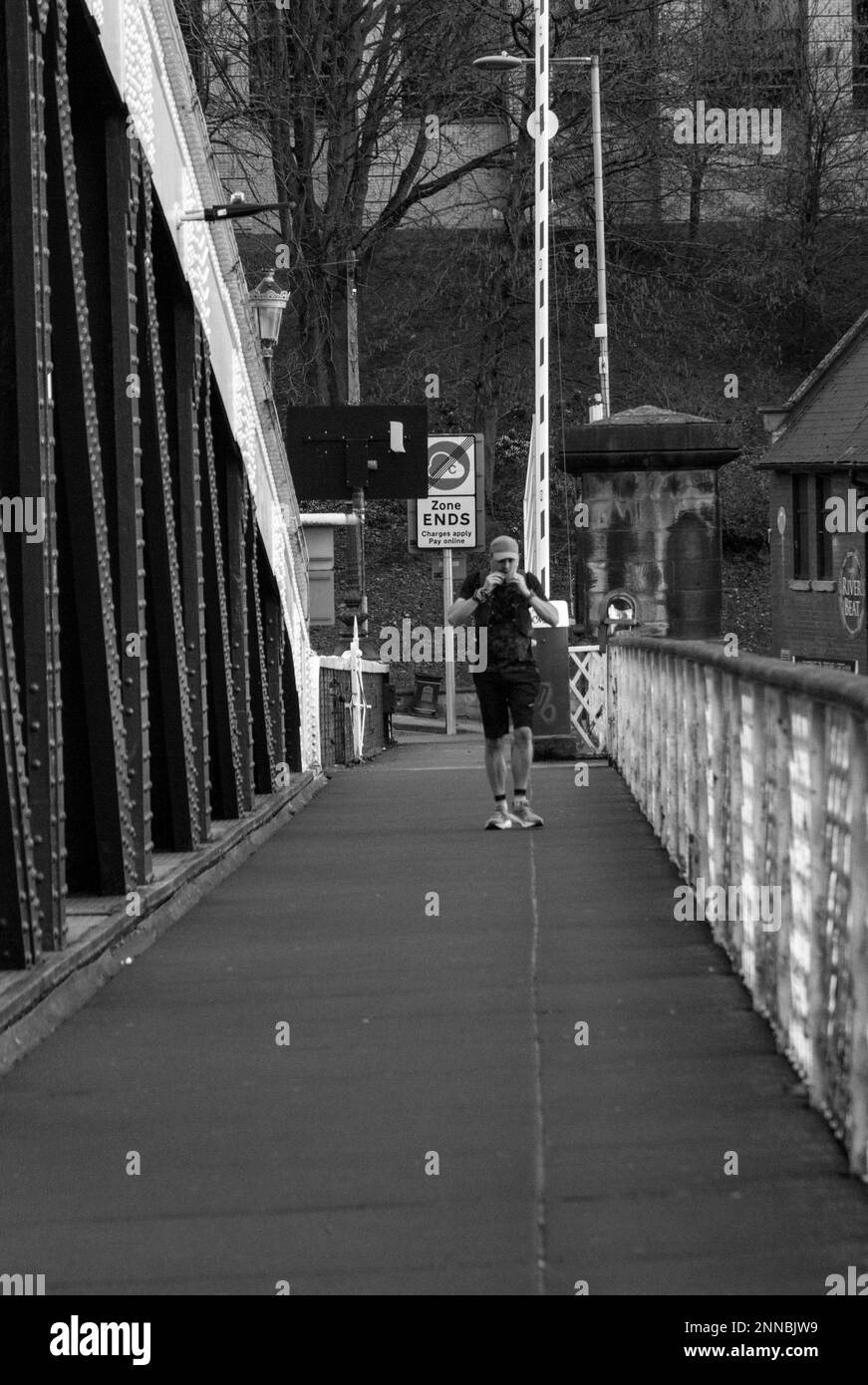 Person crossing bridge river Black and White Stock Photos & Images - Alamy