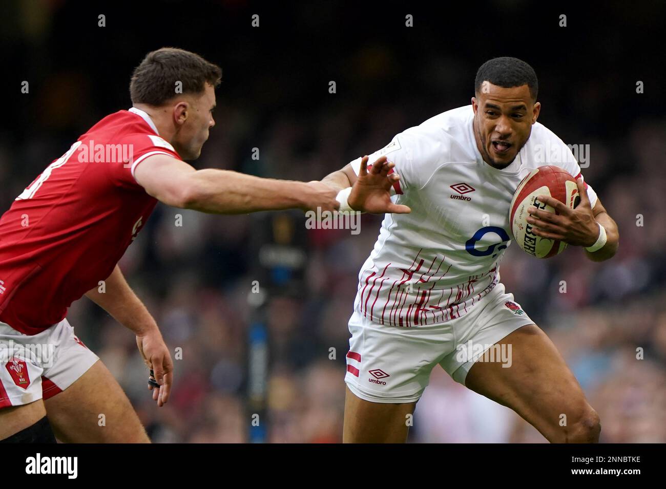 England's Anthony Watson (right) holds off Wales' Mason Grady during ...