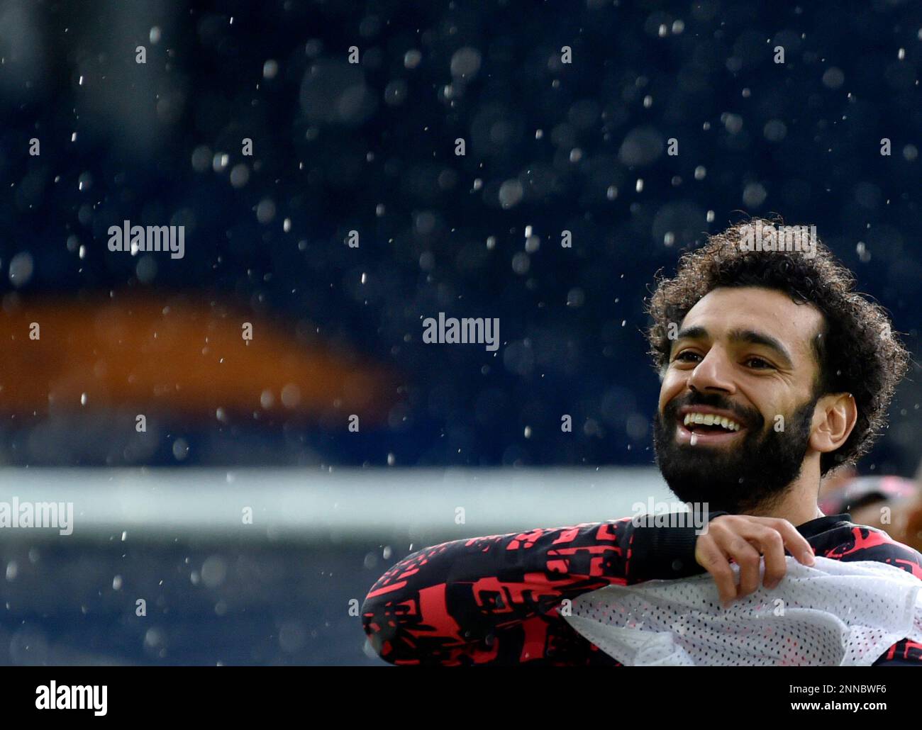 Liverpool's Mohamed Salah smiles during warm up before the English ...