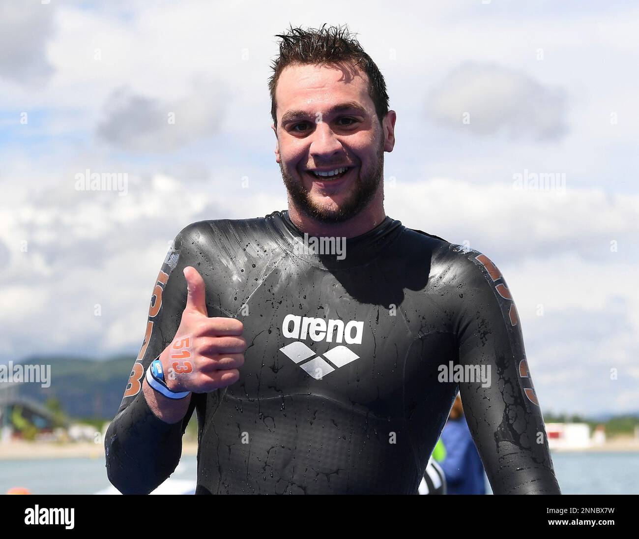 Axel Reymond of France celebrates after winning the men's open water ...