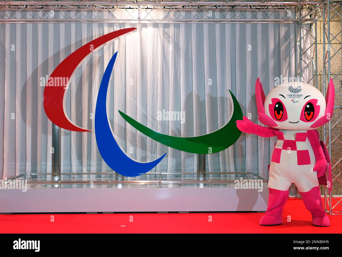 The Paralympic symbol, three "agitos" (Latin for "I move") is shown ...