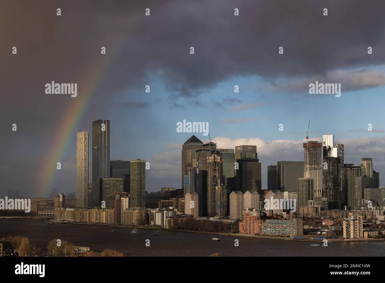 London, UK. 25th February, 2023. UK Weather: Rainbow breaks over Canary ...