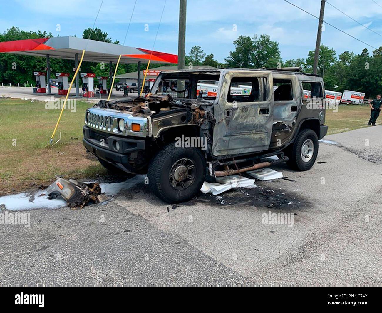 In this photo provided by Citrus County Fire Rescue an officer stands ...