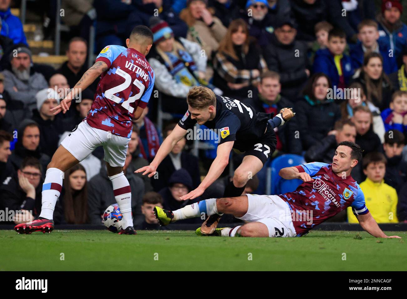 Jack Rudoni #22 of Huddersfield Town is challenged by Josh Cullen #24 ...