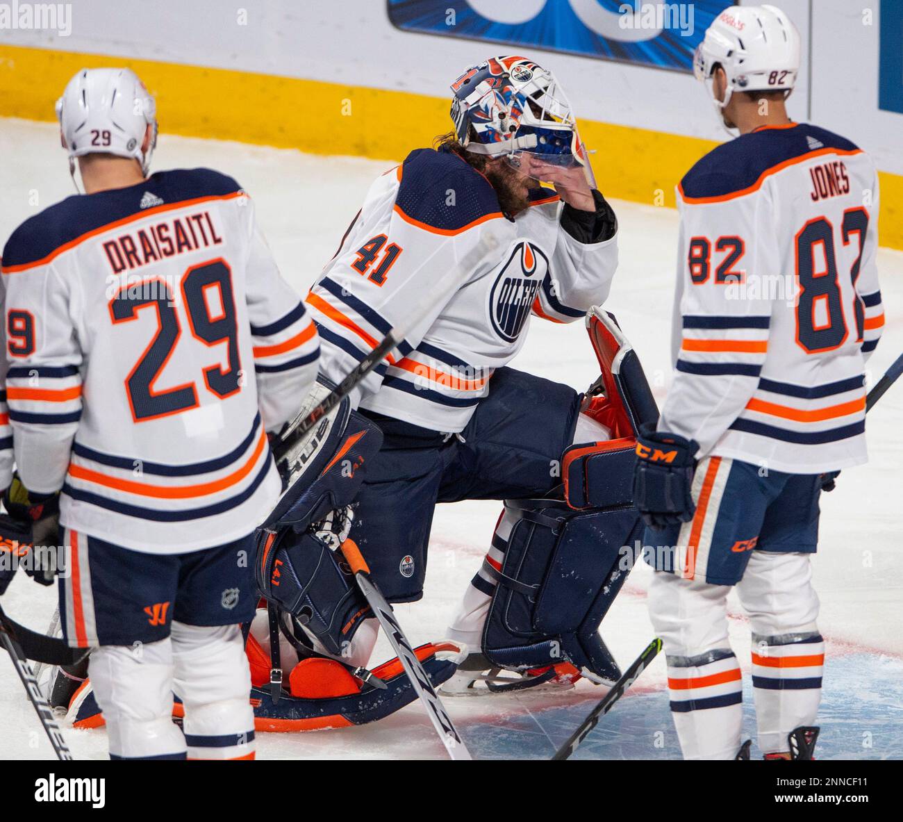 Edmonton Oilers goaltender Mike Smith (41) rubs his head after taking a ...