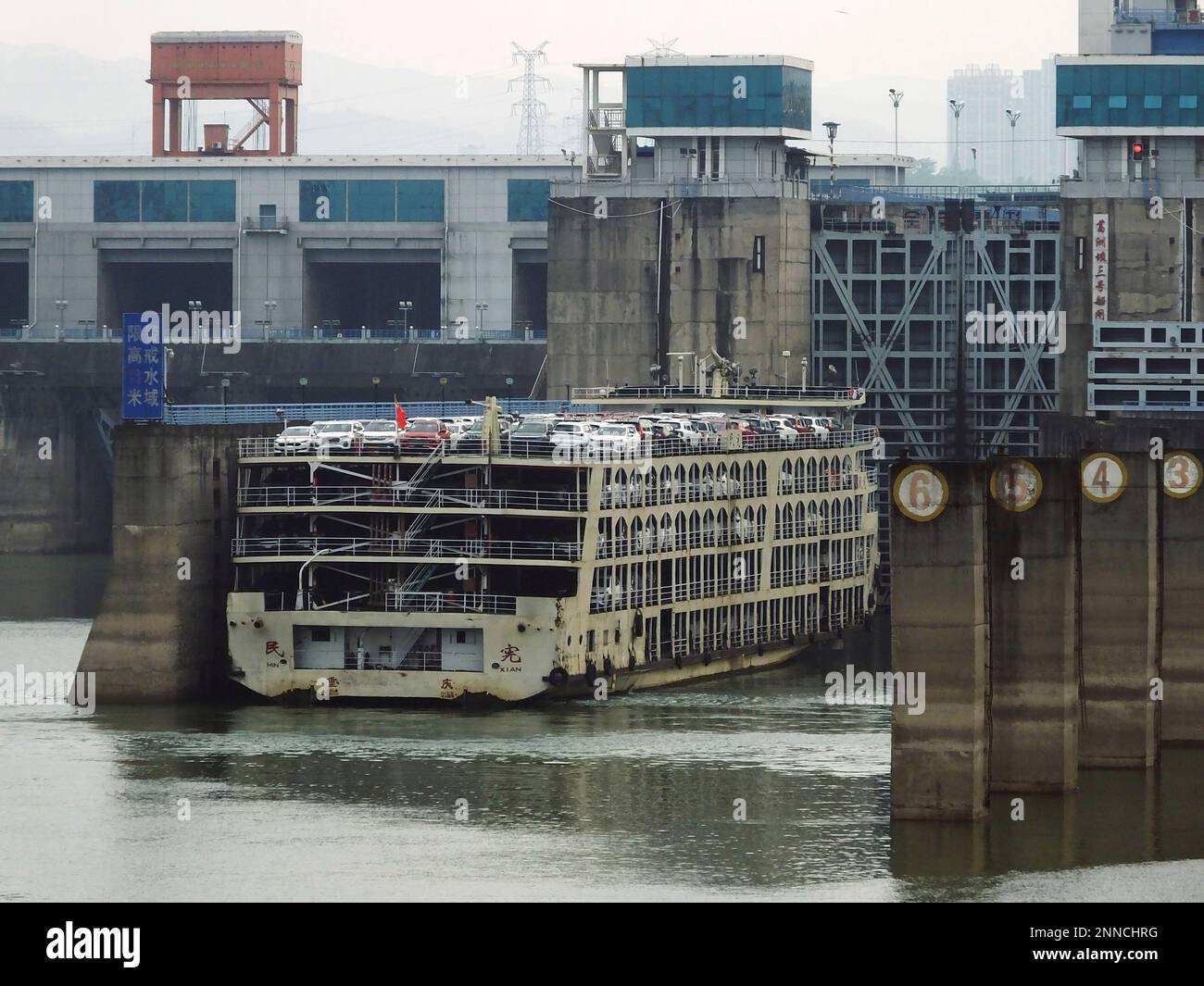 A ro-ro ship carrying new cars passes through the Gezhouba shiplock on ...