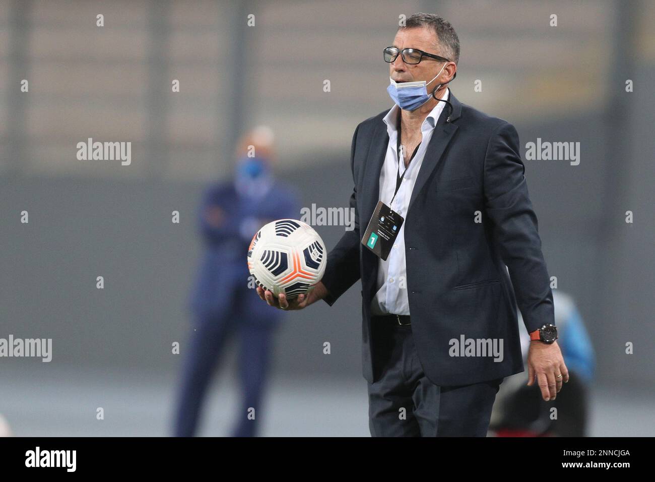 Coach Juan Antonio Pizzi of Argentina's Racing Club holds the ball ...