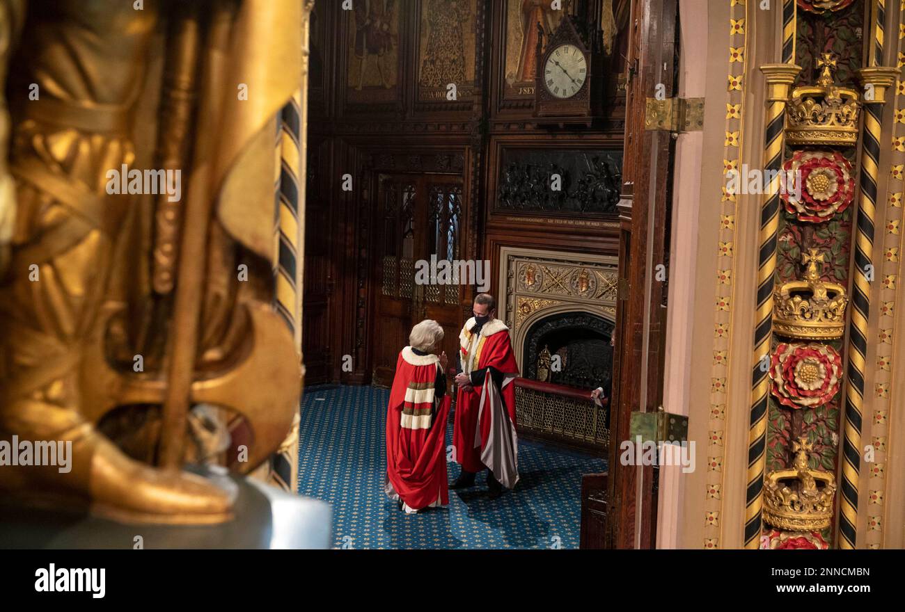 Members of the House of Lords wearing their robes wait to enter their ...