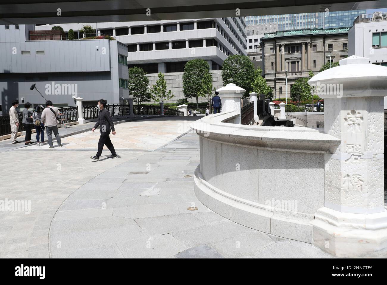 Pedestrians walk on the Tokiwa Bridge, which has been renovated after a ...