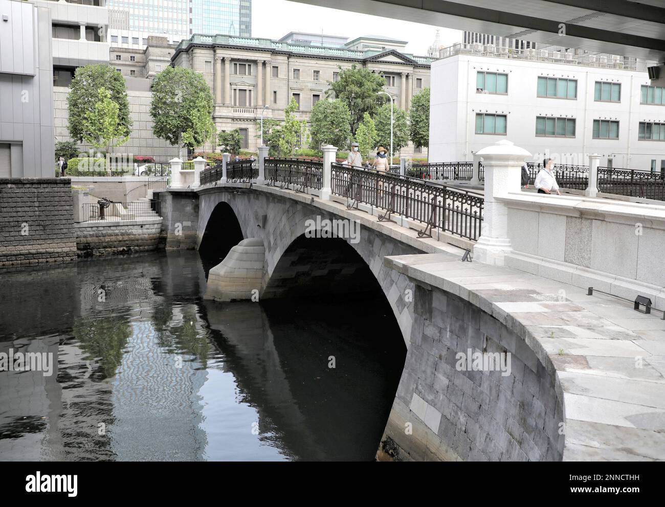 Pedestrians walk on the Tokiwa Bridge, which has been renovated after a ...