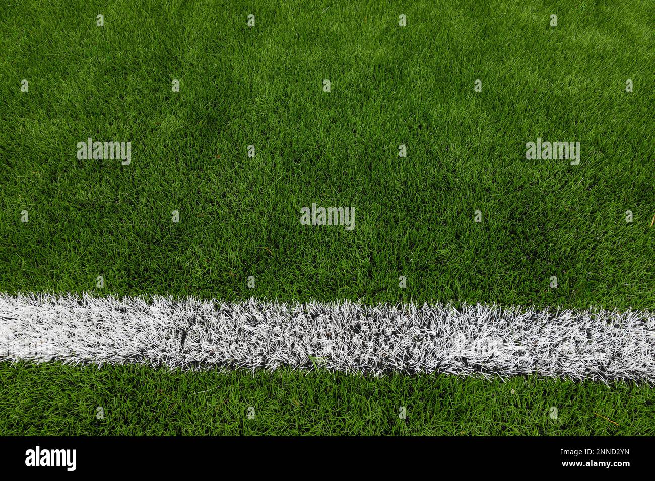 Photo of a green synthetic grass sports field with white line shot from ...