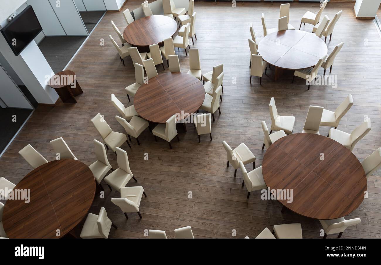 Abstract modern interior of cafe or meeting room with rounded armchairs ...