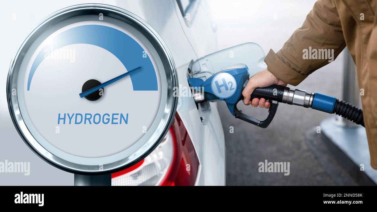 Close up of fuel cell car with connected hydrogen fueling nozzle and ...