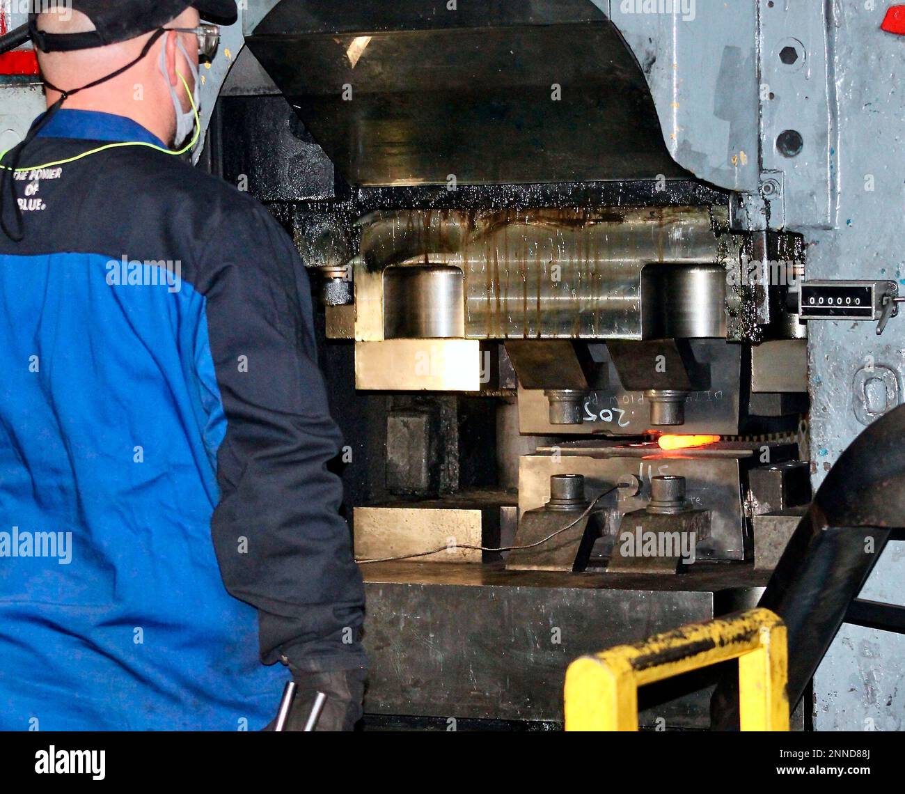 Malco employee Charles Strain watches as a plate for an Eagle Grip 10 ...