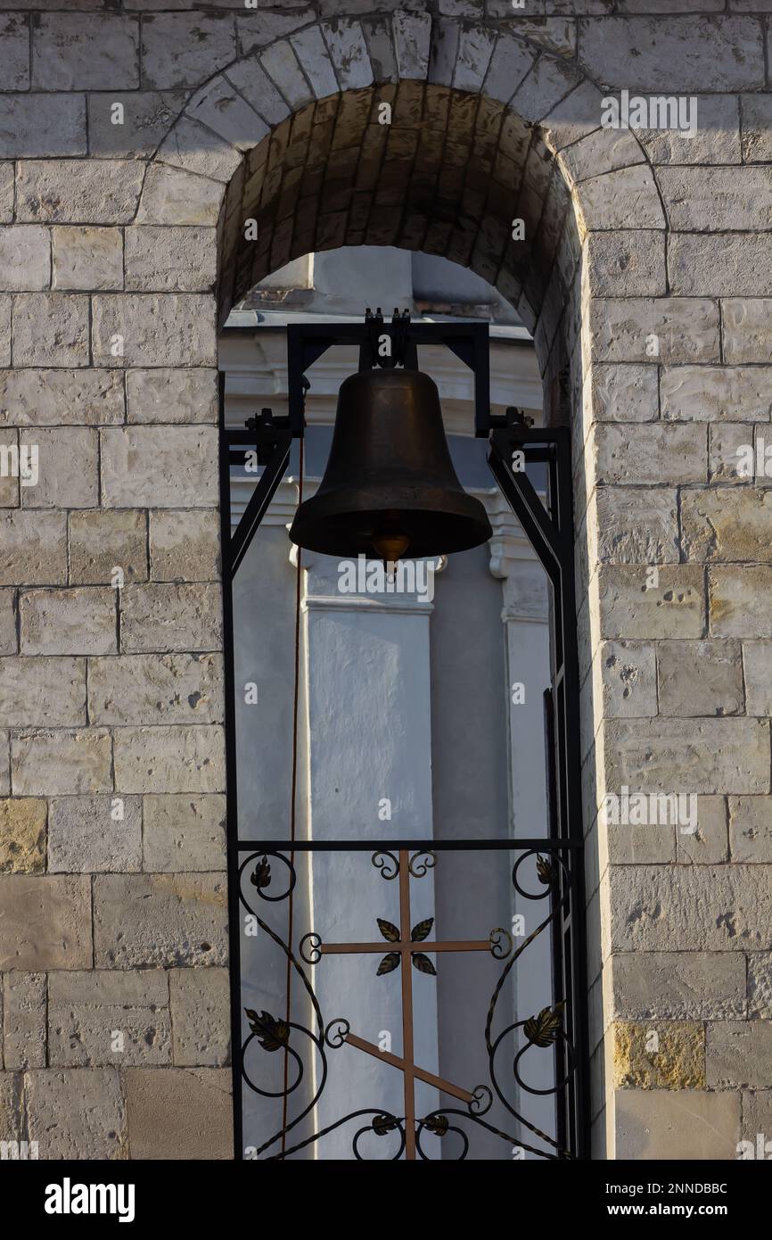 Large Church bell hanging outside. Close-up view of metal orthodox ...
