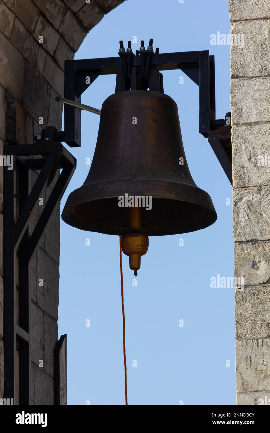 Large Church bell hanging outside. Close-up view of metal orthodox ...