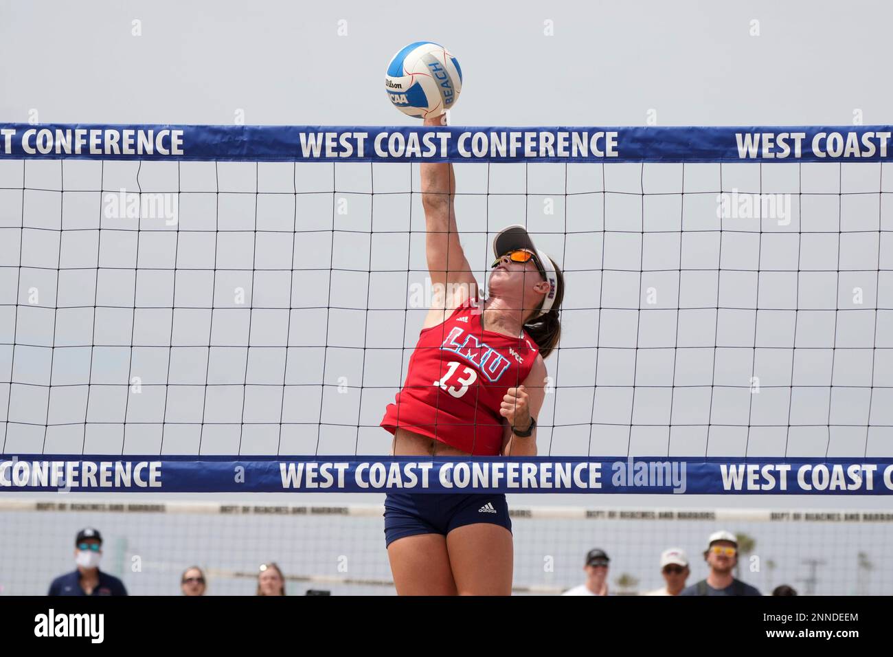 Darby Dunn of Loyola Marymount spikes the ball against Pepperdine ...
