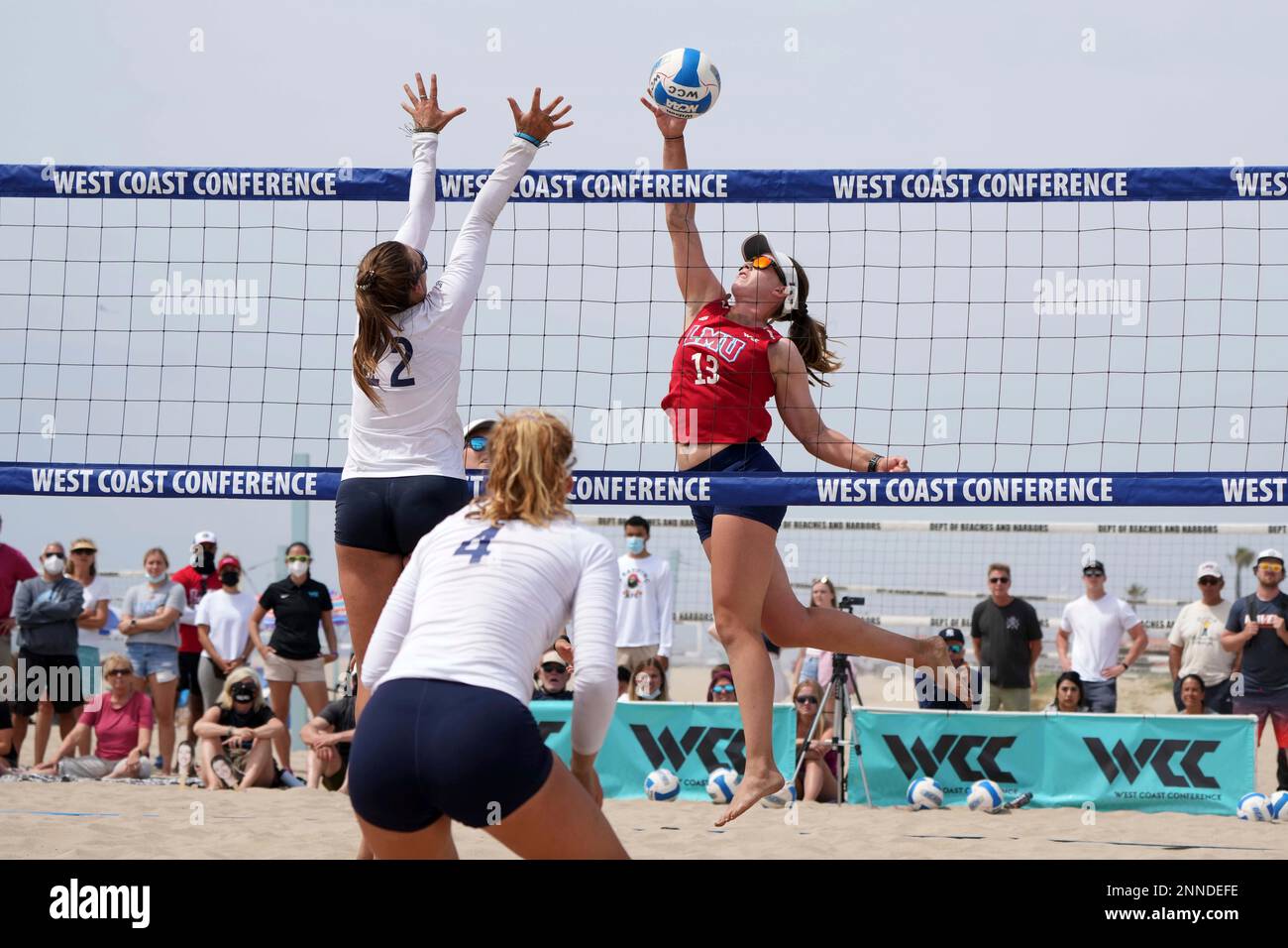 Darby Dunn of Loyola Marymount hits the ball over Gracie Pedersen of ...