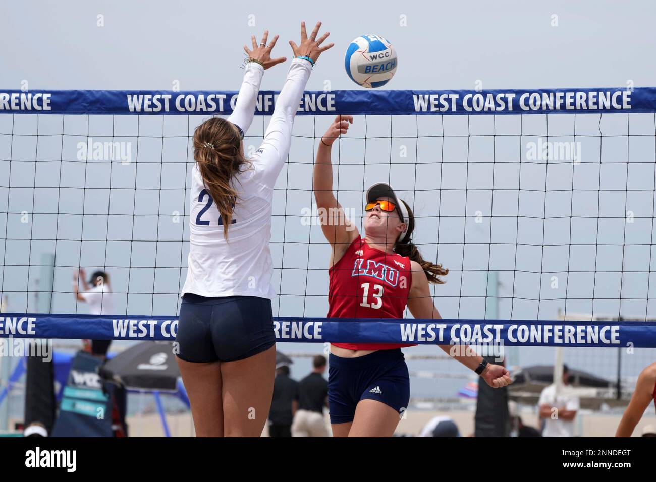 Darby Dunn of Loyola Marymount hits the ball over Gracie Pedersen of ...