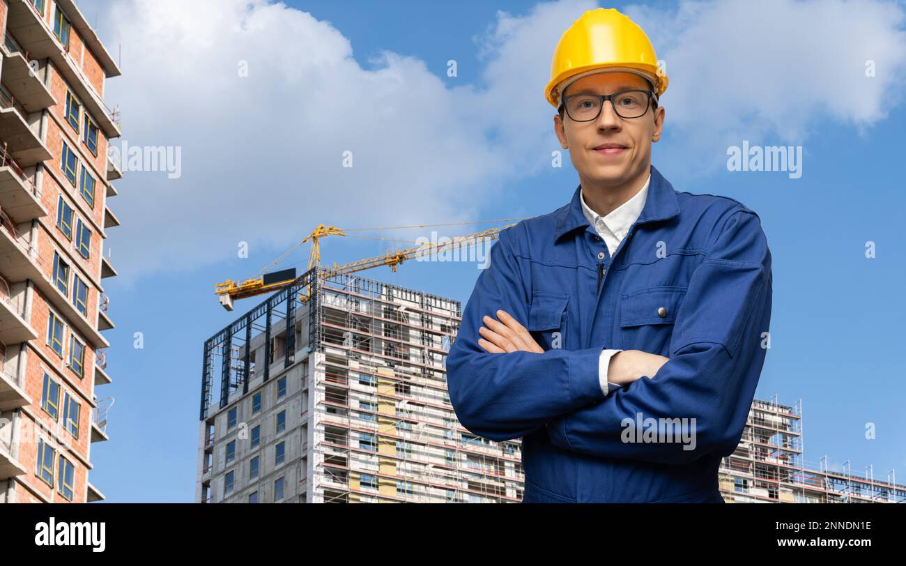 Engineer on the background of a building under construction Stock Photo ...