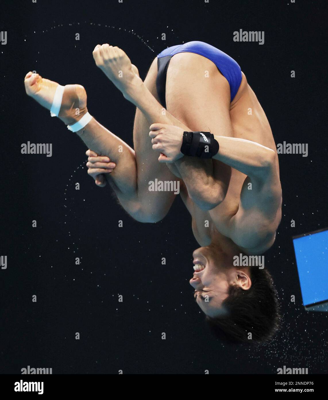 Rikuto Tamai of Japan performs during men's 10m Platform preliminary of ...