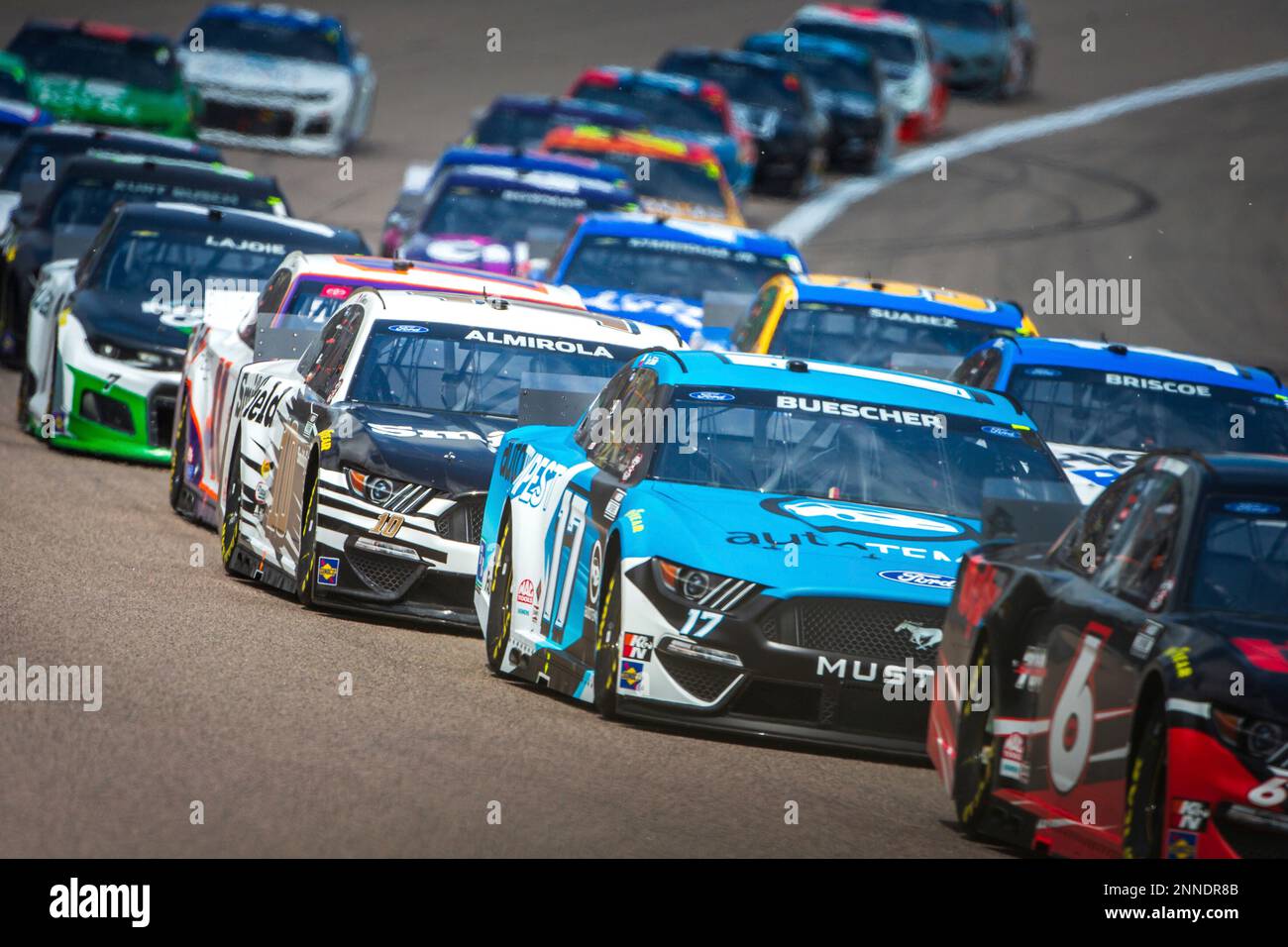 KANSAS CITY, KS - MAY 02: Race cars round turn 3 during the NASCAR Cup ...