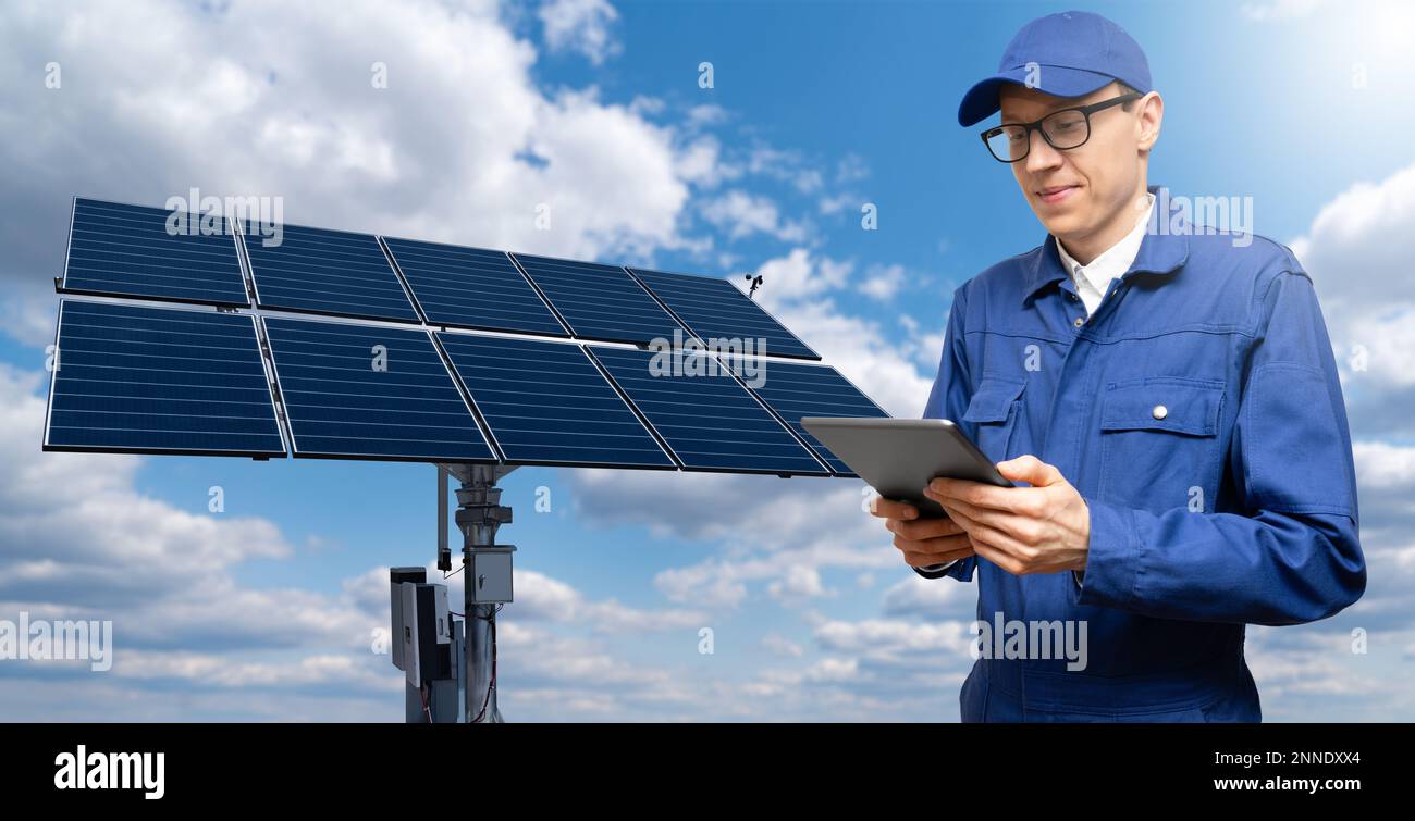 Engineer with tablet computer on a background of solar energy power ...