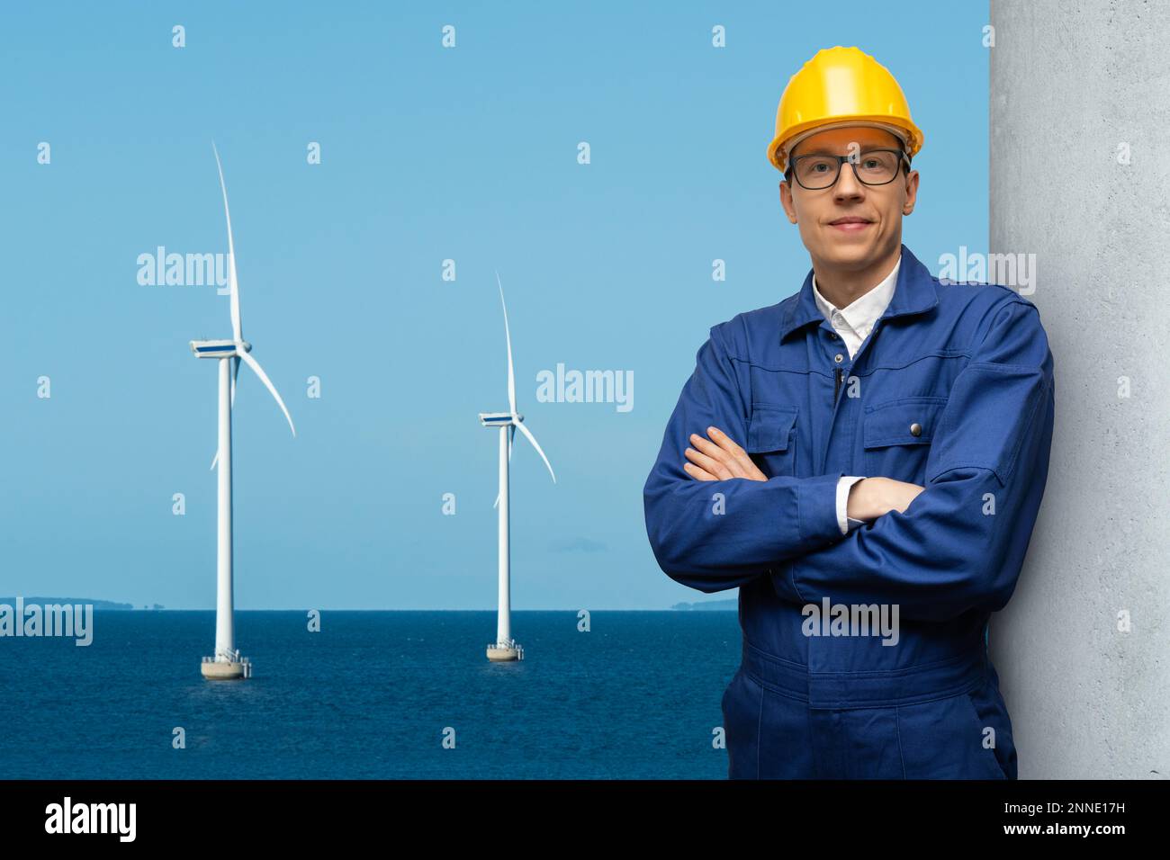 Engineer on a background of wind turbines at sea Stock Photo - Alamy