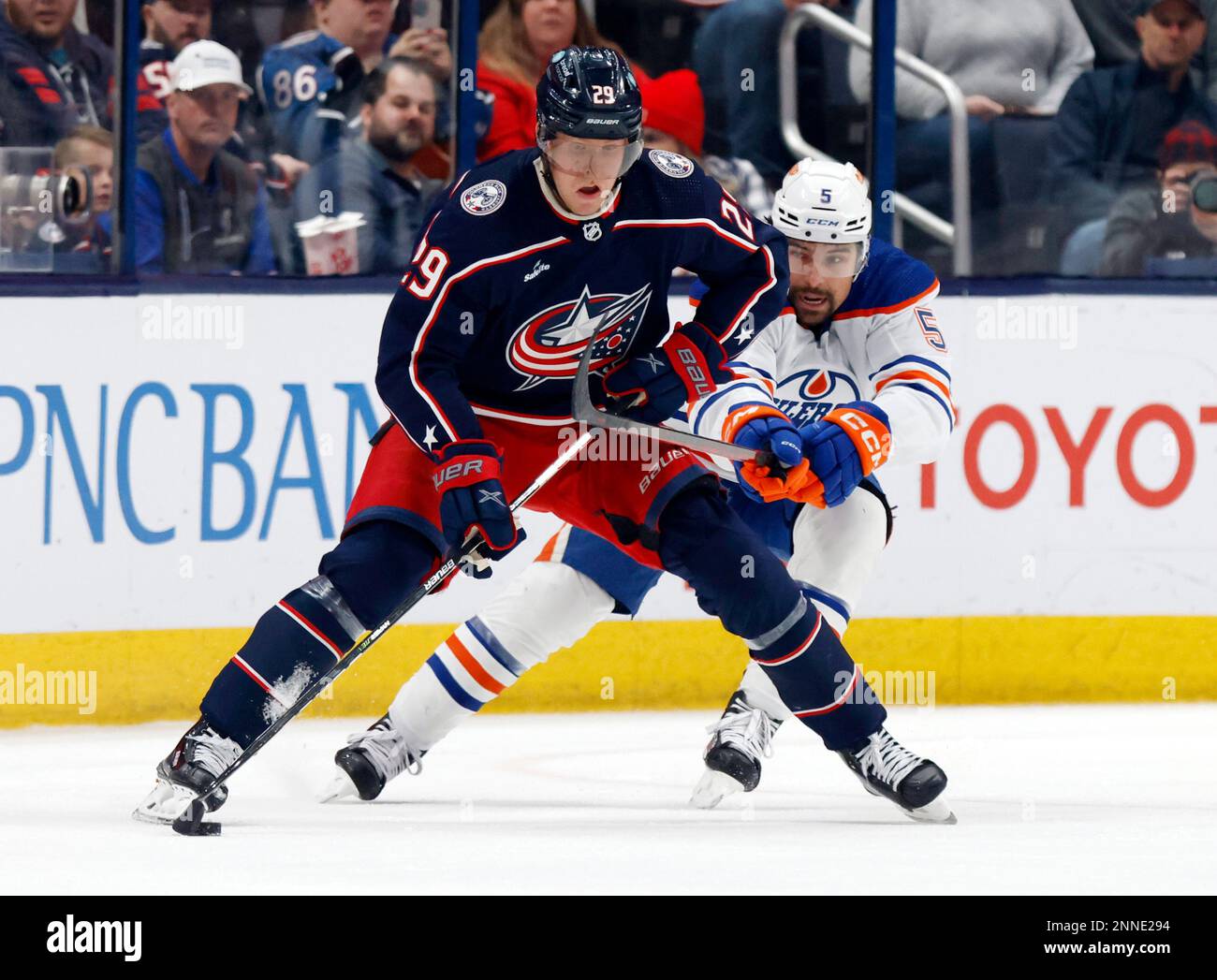 Columbus Blue Jackets forward Patrik Laine, left, controls the puck in ...